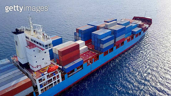 ULCV container ship sails on open water fully loaded with containers ...