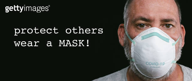 Old man wearing an anti virus protection mask to prevent others from ...