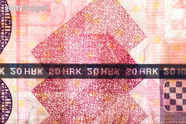 Plastic security strip inside 20 HRK banknote. Security strip on ...