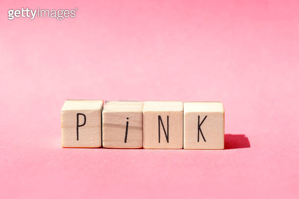 Wooden cubes lie in a row on pink background with the word Pink, Pastel ...
