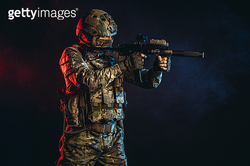 soldierly military man in smoky UV background 이미지 (1226341205) - 게티이미지뱅크