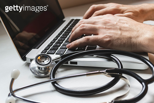 medical teleworking with laptop and stethoscope. telemedicine concept ...