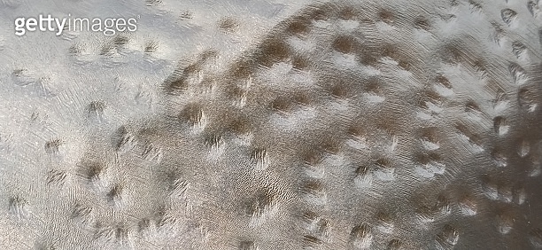 Bronze metal surface. Uneven metal texture with scratches, gouges and ...