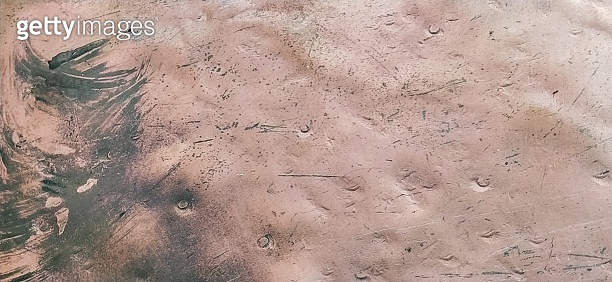 Bronze metal surface. Uneven metal texture with scratches, gouges and ...