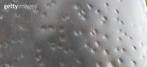 Bronze metal surface. Uneven metal texture with scratches, gouges and ...