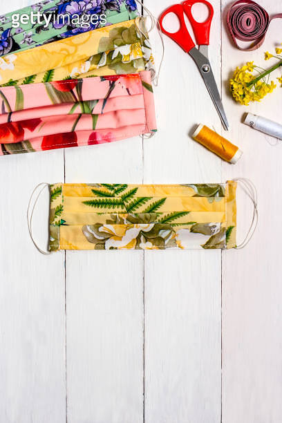 Production of protective medical masks from coronavirus hand sewing ...