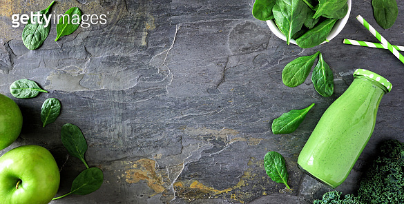 Banner with healthy green smoothie double border, top view in milk ...