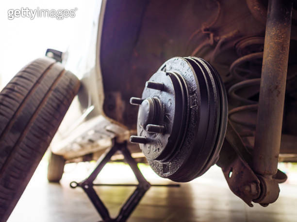 A rear hub of the car after removing a tire and wheel, maintaining a ...