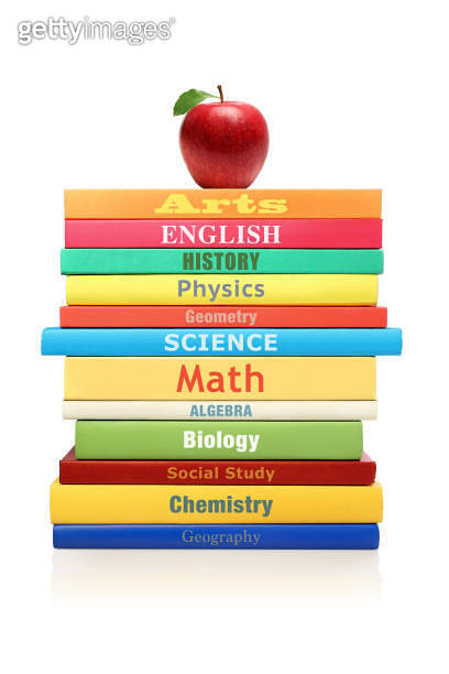 Red Apple on a Stack of School Subject Books on White Background 이미지 ...