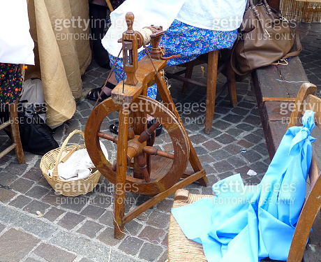 Old tool for spinning wool. Reenactment of ancient medieval works ...