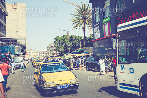 People working and traffic at Senegal capital Dakar, West Africa ...