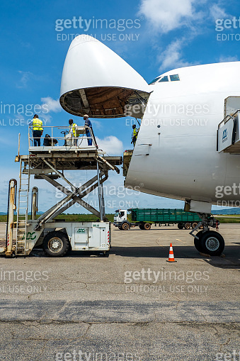 A Boeing 747 Jumbo Jet freighter aircraft with a wide open nose cargo ...