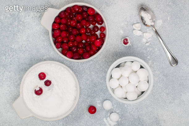 Cranberries in powdered sugar. Small round white berry candies ...