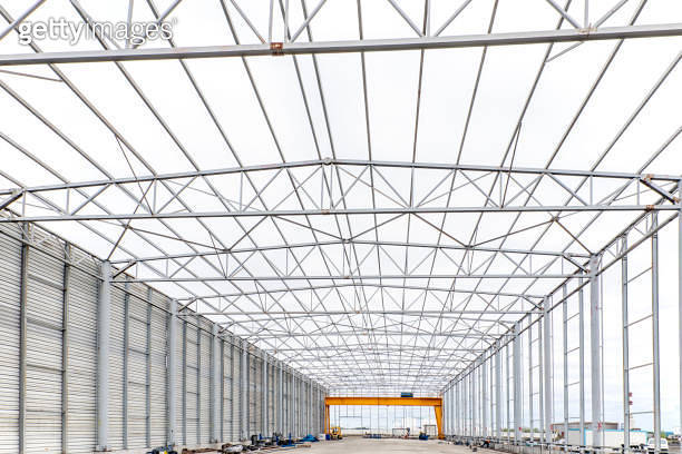 View of the industrial structural steel building under construction and ...