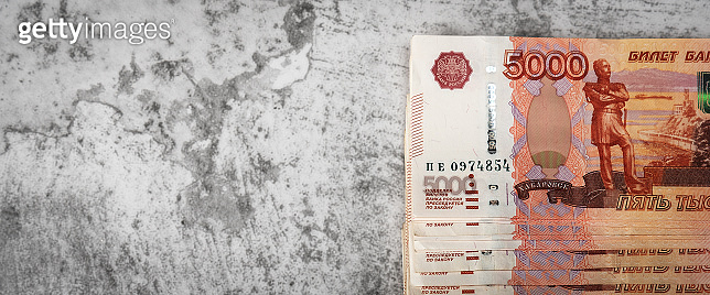Russian cash banknotes of five thousand rubles, the bundle hangs on a ...