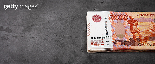 Russian cash banknotes of five thousand rubles, the bundle hangs on a ...