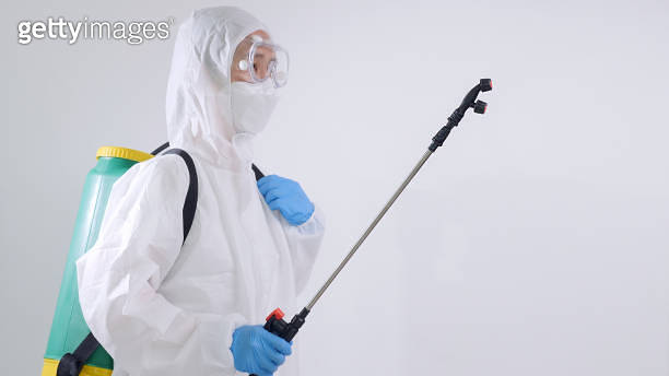 Asian virology scientists wearing PPE suit and using chemical equipment ...