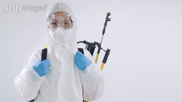 Asian virology scientists wearing PPE suit and using chemical equipment ...