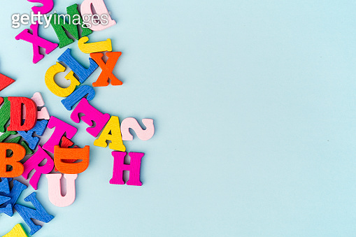 English letters on blue background composed from colorful abc alphabet ...