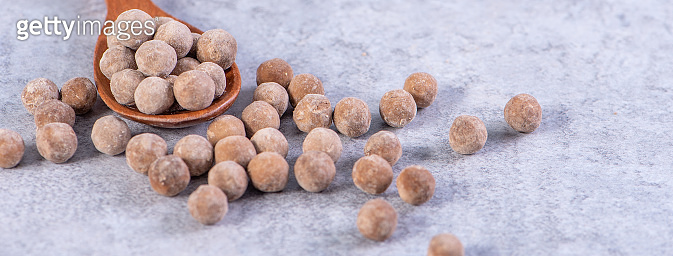 Dry raw brown tapioca pearls isolated on gray cement concrete ...
