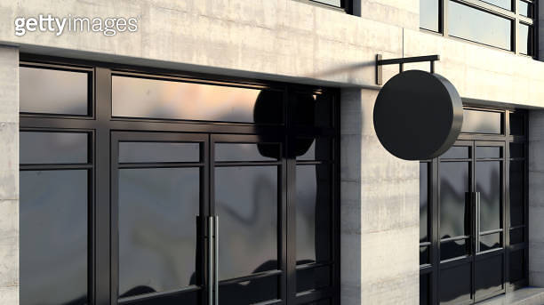 Round Black Sign Outside Shop Facade (1220086999) - 게티이미지뱅크