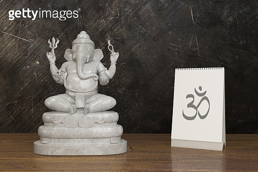 Lord Ganesh sculpture,Hindu statue of ganpati with Om Calendar on the ...