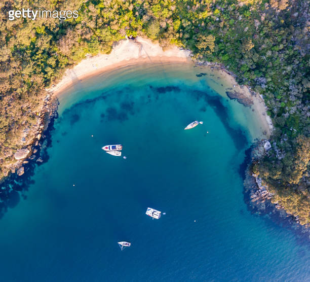 Aerial drone bird's eye view of sailboats and yachts anchored at Store ...