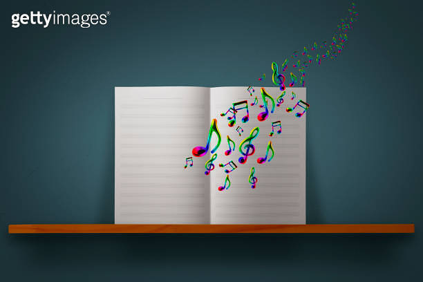 Blank Sheet Music with flying multi colored Musical Note on a wooden ...