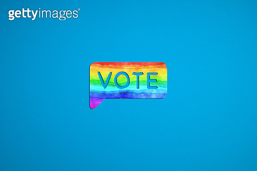 An election icon made by cutting colored paper. A blue background. 이미지 ...