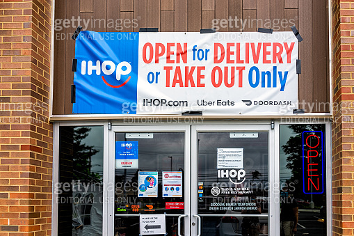 Building entrance sign for open ihop restaurant for take-out and ...