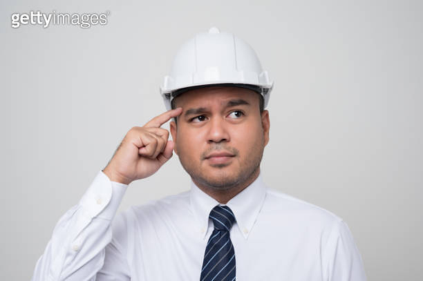 Young asian civil engineer helmet hard hat standing and thinking on ...
