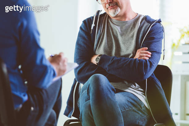 Sad man talking listening to psychotherapist during session (1203141128 ...