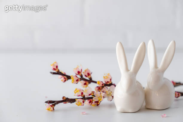 Easter spring decorative composition with white Easter ceramic bunny ...