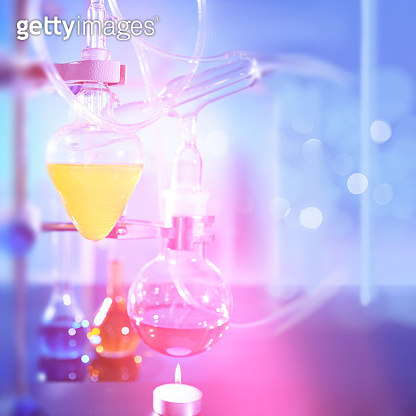 Reaction in progress in organic chemistry lab, distillation glassware ...