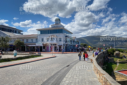 Cityscape of Hermanus Marine Drive seen from cliff path coastal trail ...