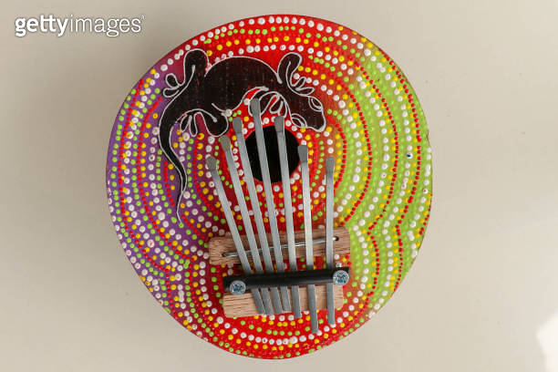 Traditional musical instrument karimba with gecko lizard motif. Close ...