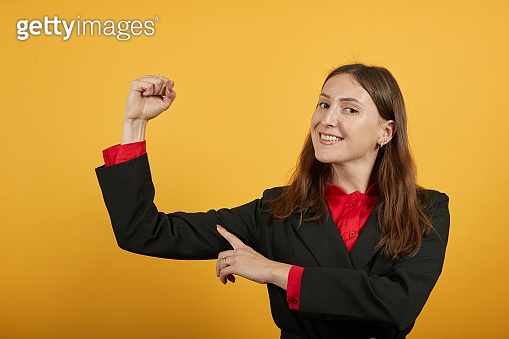 Smiling Woman Shows Muscles, Biceps On Her Arm. Strong People, Winners ...