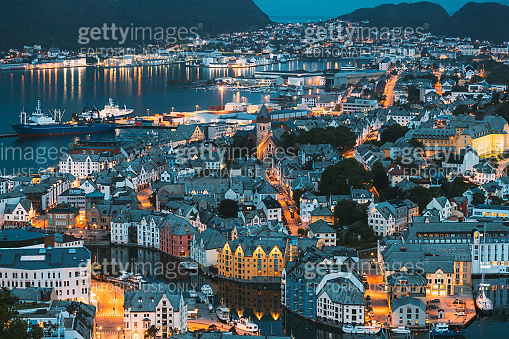Alesund, Norway. Night View Of Alesund Skyline Cityscape. Historical ...