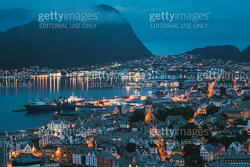 Alesund, Norway. Night View Of Alesund Skyline Cityscape. Historical ...
