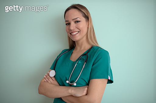 Young nurse feeling extremely shocked and surprised, anxious and ...