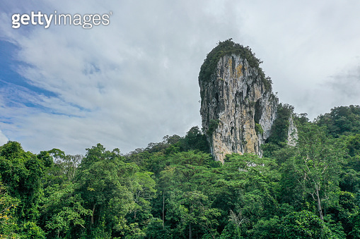 Aerial view of Batu Punggul, is a jungle-topped limestone outcrop ...