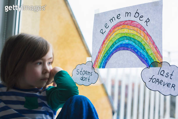Child in isolation at home. His drawings on home window. Covid-19 ...