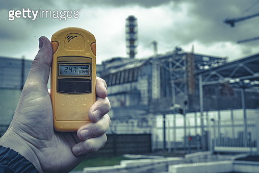 radiometer in hand with fourth Chernobyl Nuclear Power Plant ...