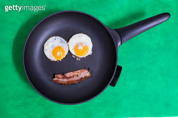Funny Face of Bacon and Eggs Cooking in a Frying Pan 이미지 (1204329058 ...