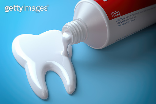 Toothpaste in the shape of tooth coming out from toothpaste tube ...