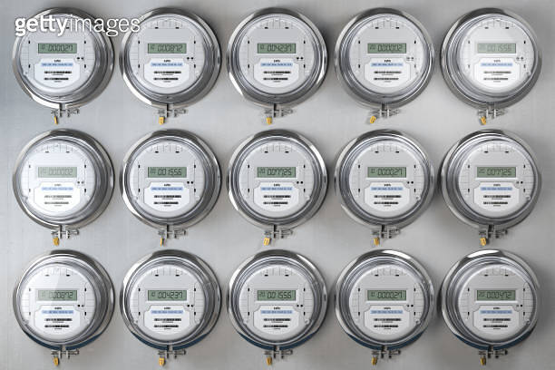Digital electric meters in a row measuring power use. Electricity ...