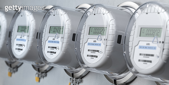 Digital electric meters in a row measuring power use. Electricity ...