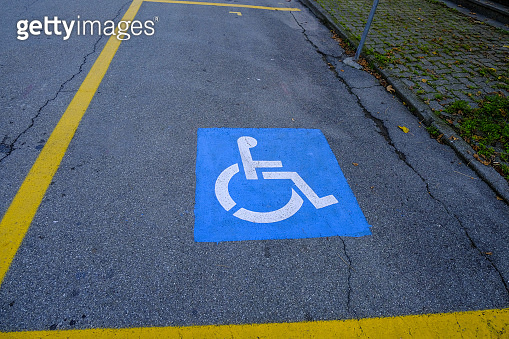 handicap parking sign close-up written on the road. Top view ...