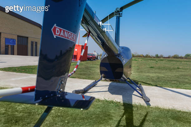 Rear view of grounded helicopter on helipad 이미지 (1206999662) - 게티이미지뱅크