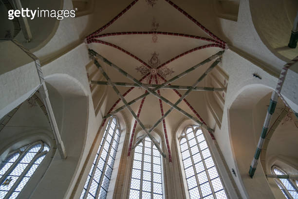 View from below into the basilical gothic rib vault with wooden struts ...